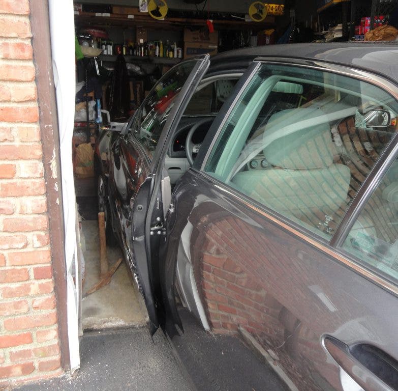 Merokean Pinned Between Car and Garage | Merrick, NY Patch