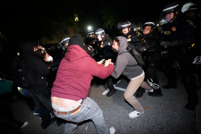 18 Photos Show Police Swarming, Dismantling UCLA Encampment | Los ...