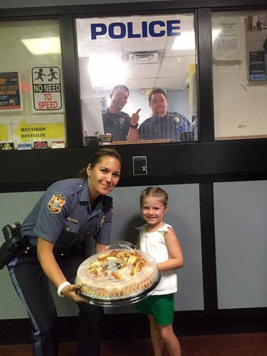 Adorable Photo of Girl Giving Hazlet Police Baked Goods | Holmdel, NJ Patch