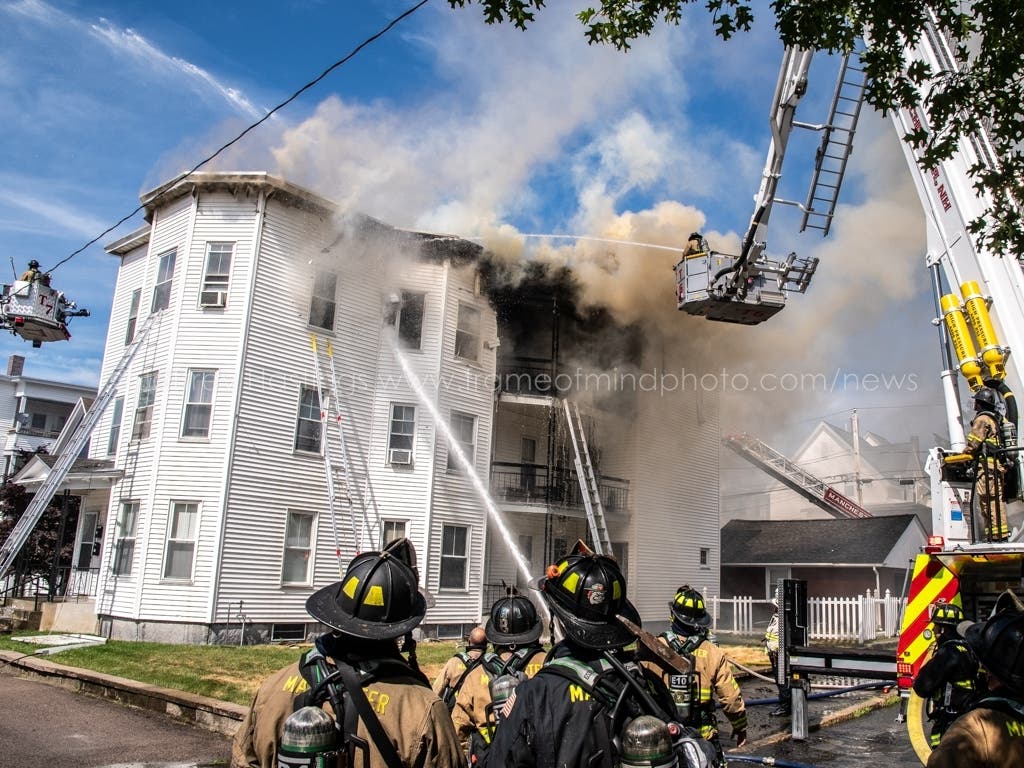 Manchester Firefighters Battle Fire That Burns Apartment Building ...